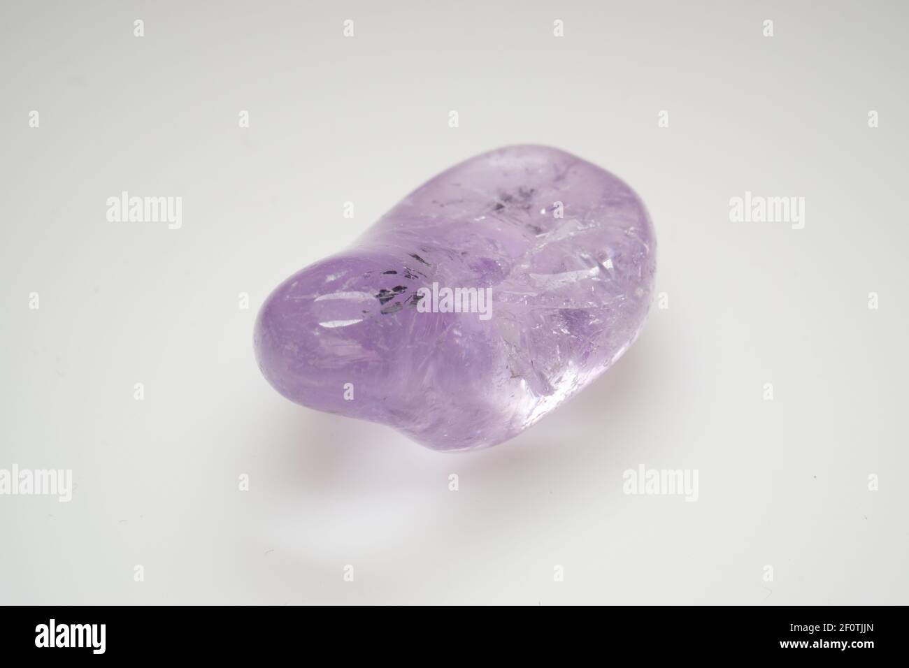 Natural stone amethyst on white background Stock Photo - Alamy