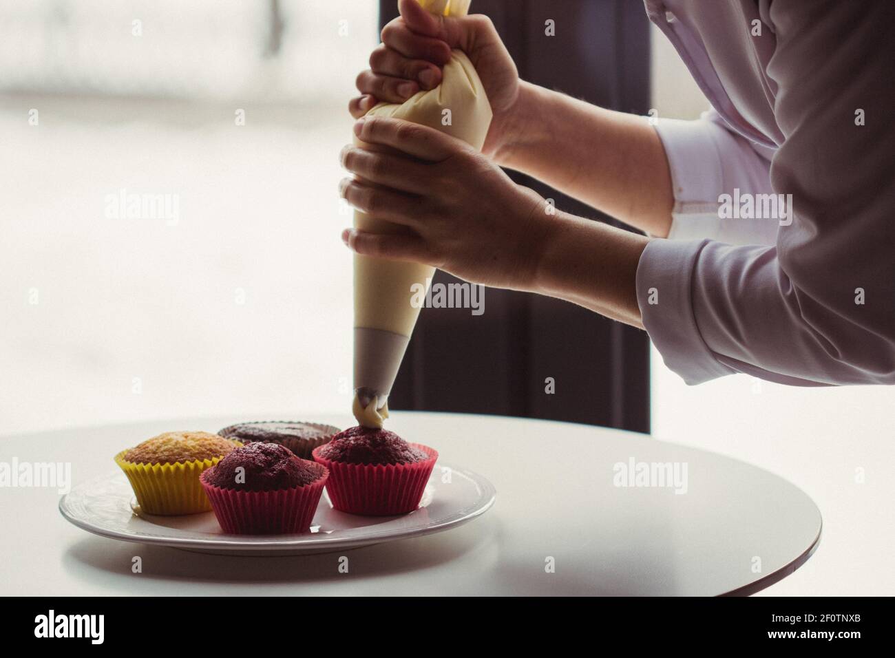 People Baking Cupcakes