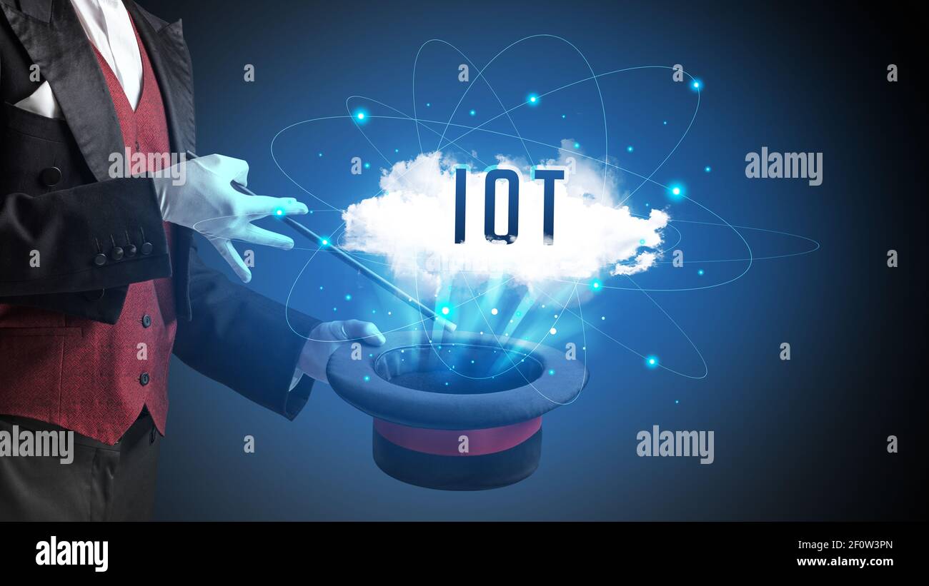 Magician is showing magic trick with IOT abbreviation, modern tech ...