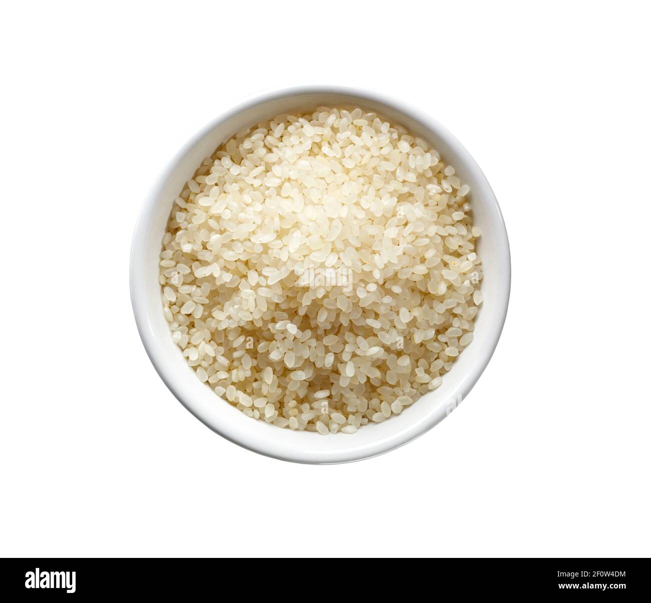 Healthy food. Raw dry rice in bowl isolated on white background with ...