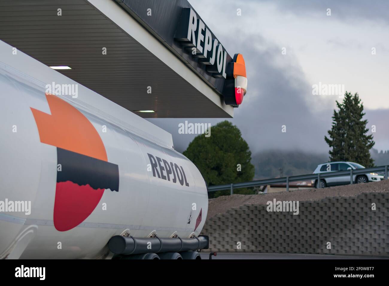 Fuel tank truck of the energy company Repsol under the canopy of a gas ...