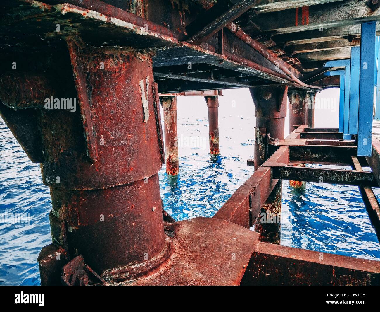 Rusty metal under the pier support. Construction Stock Photo - Alamy