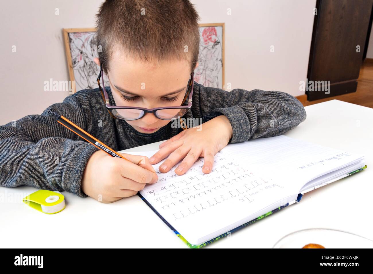Teen boy doing homework desk hi-res stock photography and images - Alamy