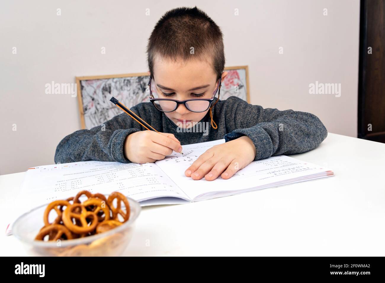 Teen boy doing homework desk hi-res stock photography and images - Alamy