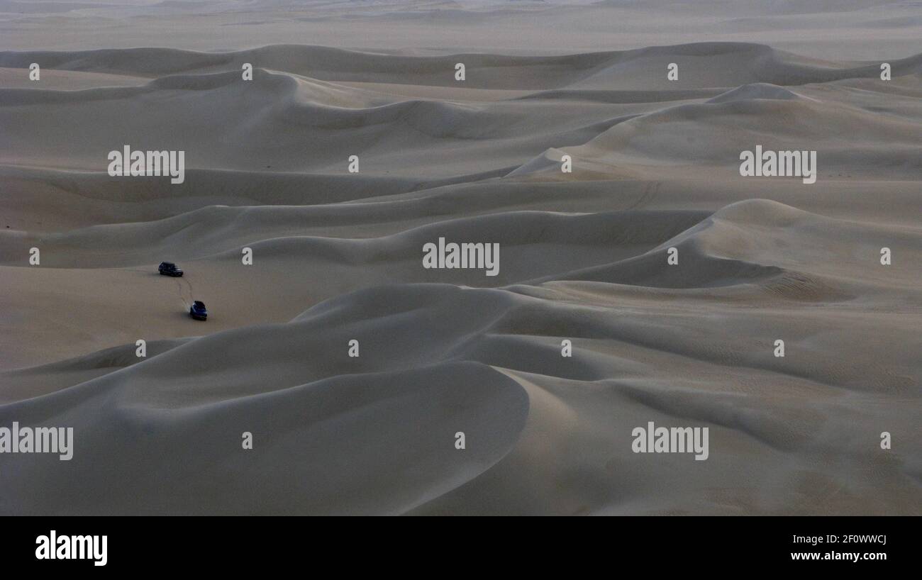 April 2008 - Siwa, Egypt - Four wheel drive vehicles traverse the sand ...