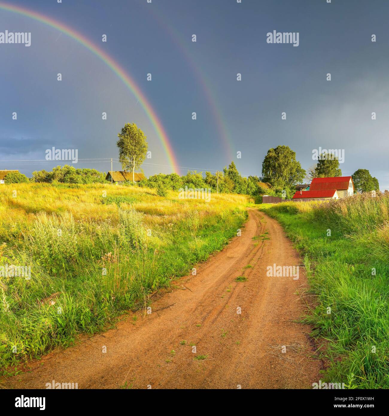 Double rainbow over village hi-res stock photography and images - Alamy