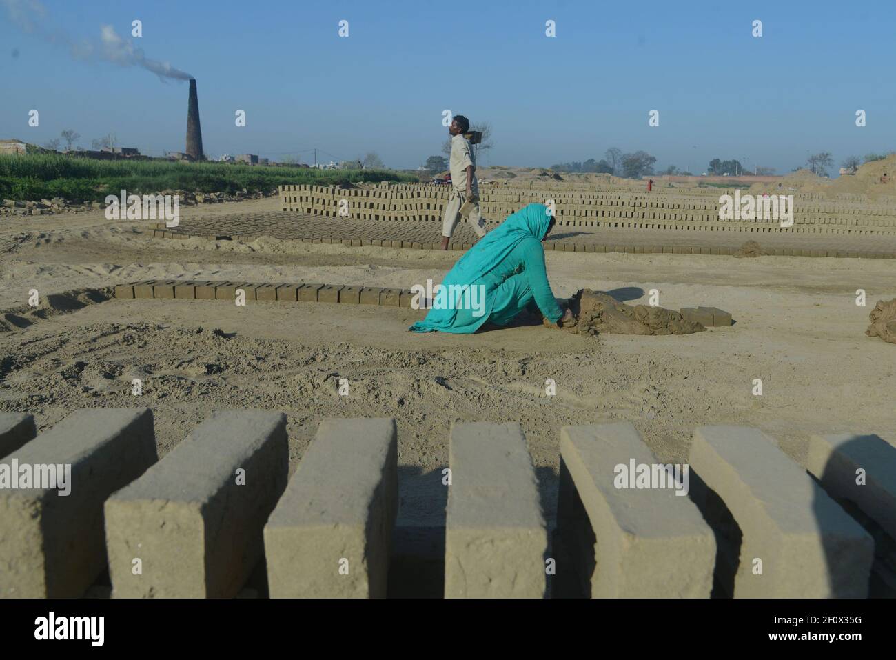 Lahore, Pakistan. 02nd Mar, 2021. Pakistani female labourer makes clay ...