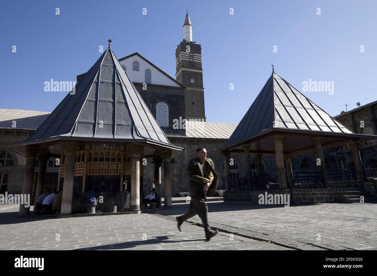 June 2008- Diyarbakir, Turkey- A man hurries into Ulu mosque for later ...