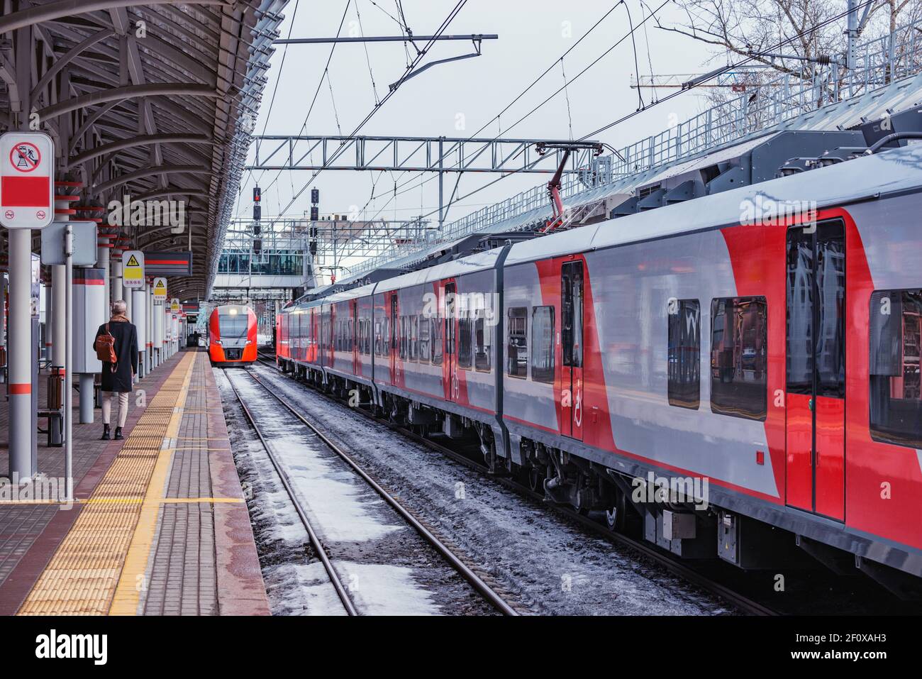 Highspeed trains by the station platform at winter day Stock Photo - Alamy
