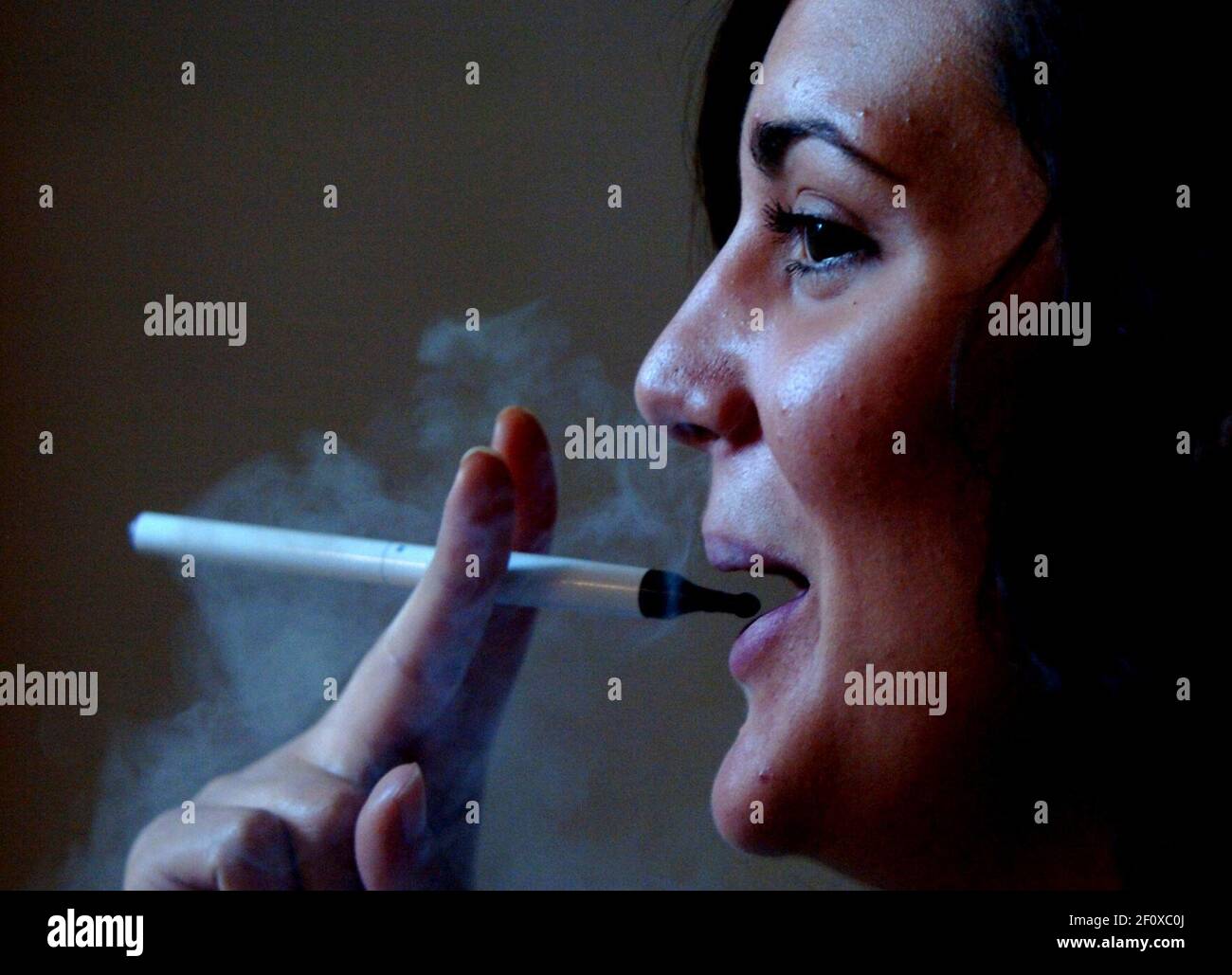 FIRST ELECTRIC CIGARETTE. A SMOKER ENJOYS ONE OF THE COMPLETELY ...