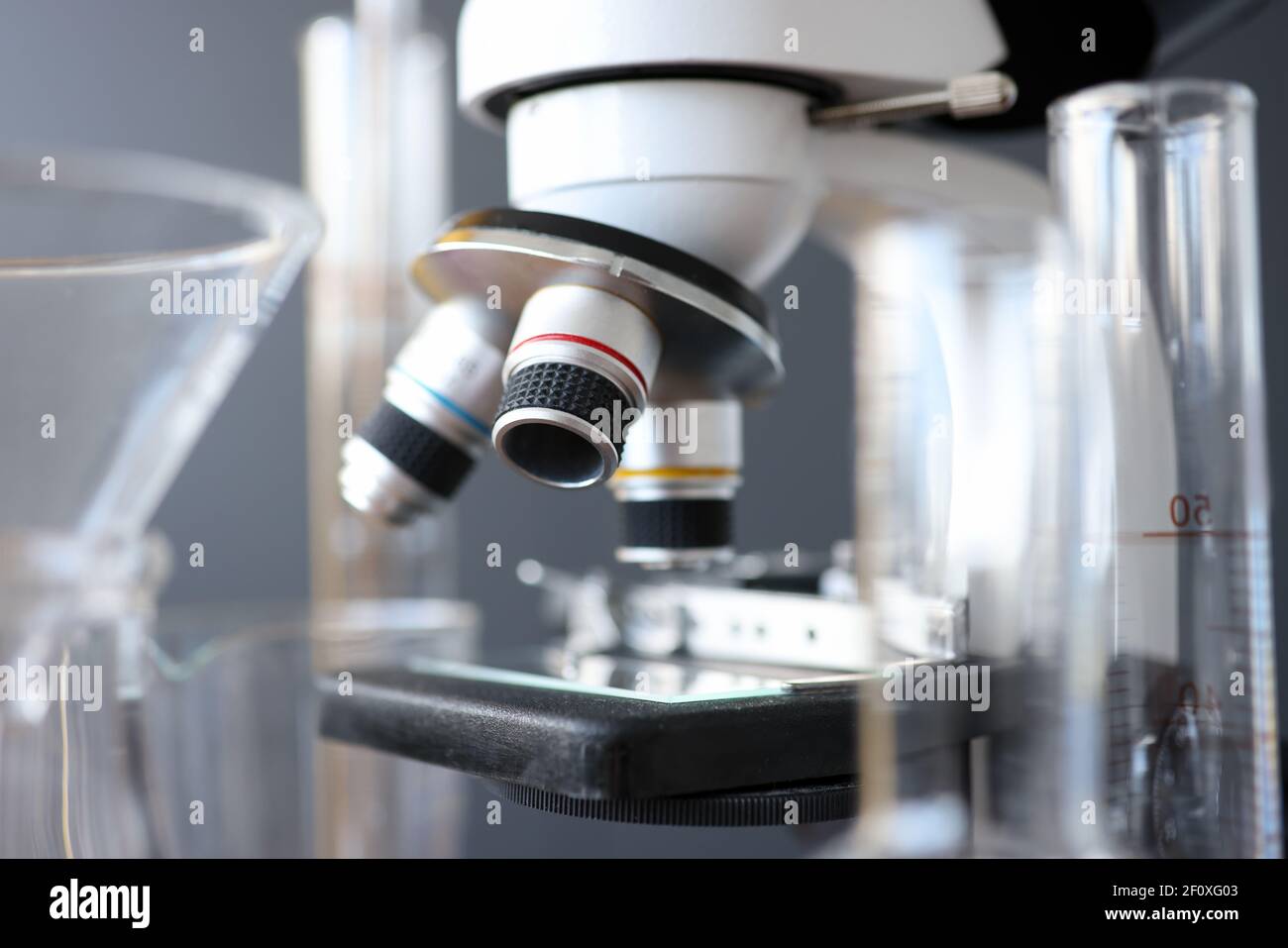 Research microscope in laboratory is next to test tubes Stock Photo - Alamy