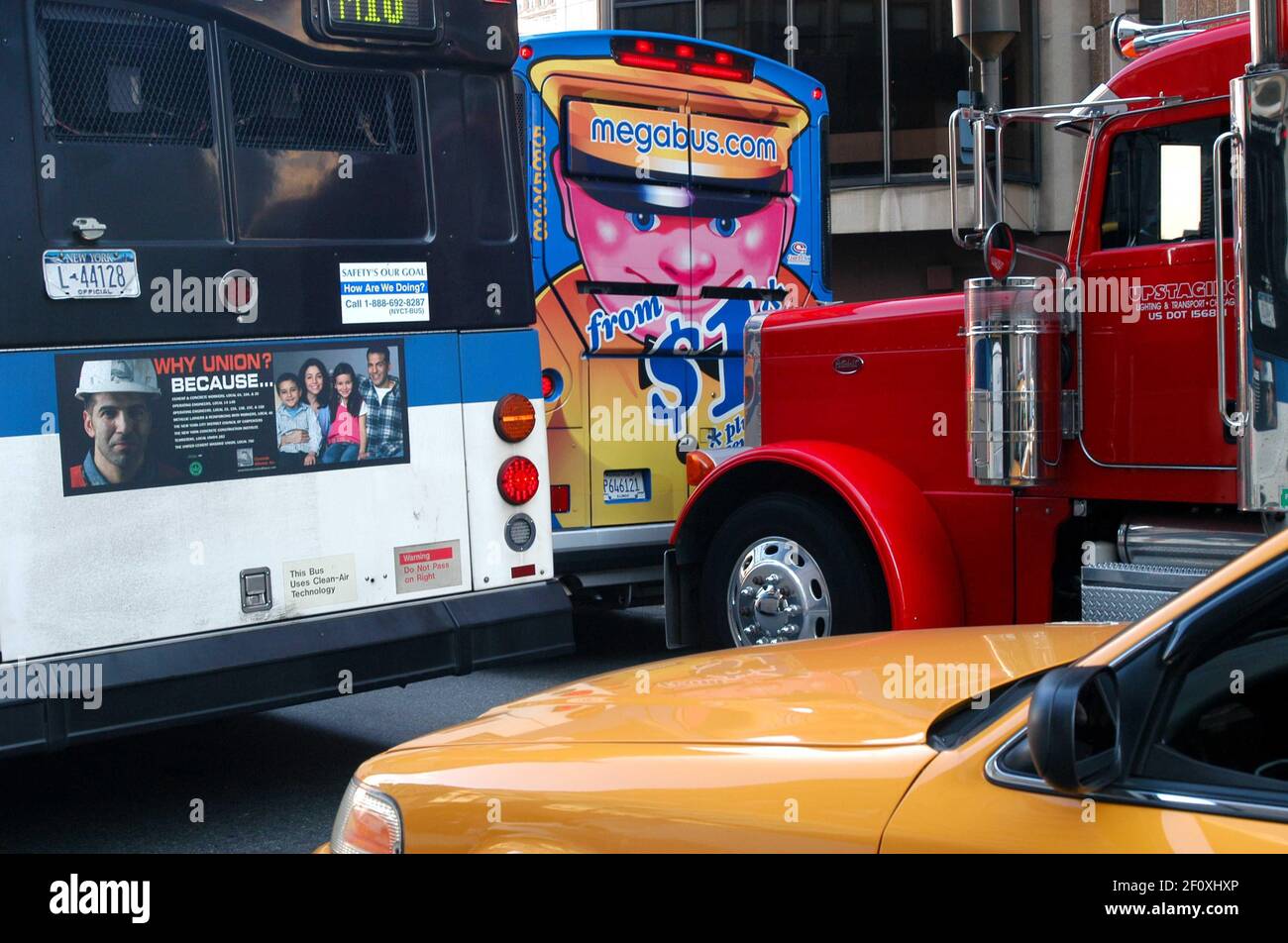 7 August 2008 - New York, NY - A Megabus.com bus picks up passengers ...