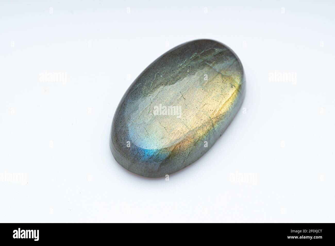 Natural stone labradorite on a white background Stock Photo - Alamy