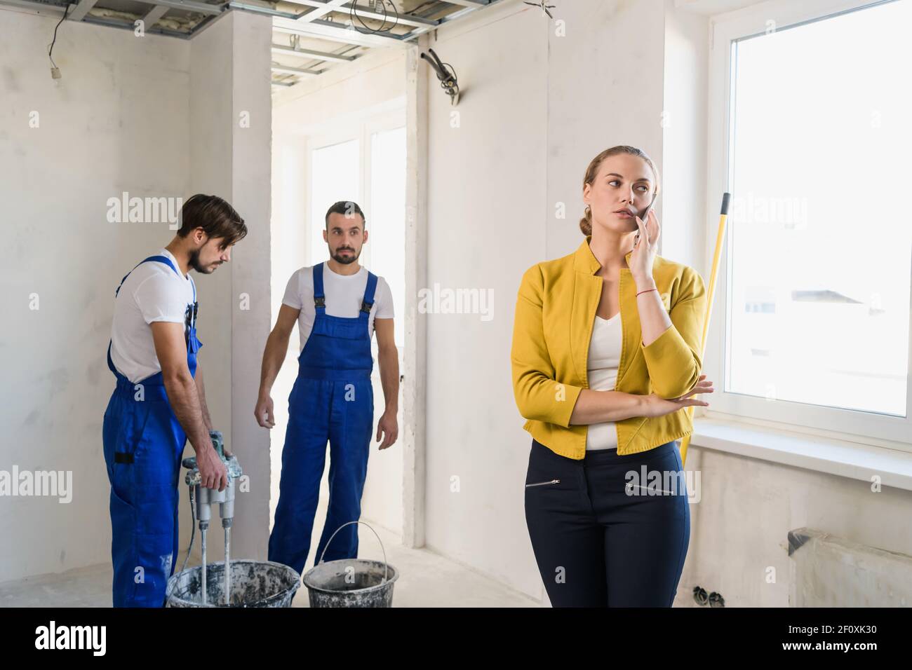 Professional builders working on apartment hi-res stock photography and ...