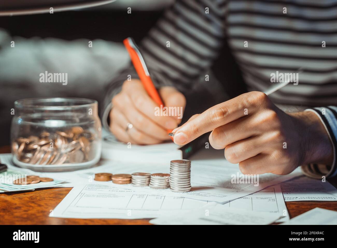 Close up cropped frustrated man calculating monthly expenses, managing ...