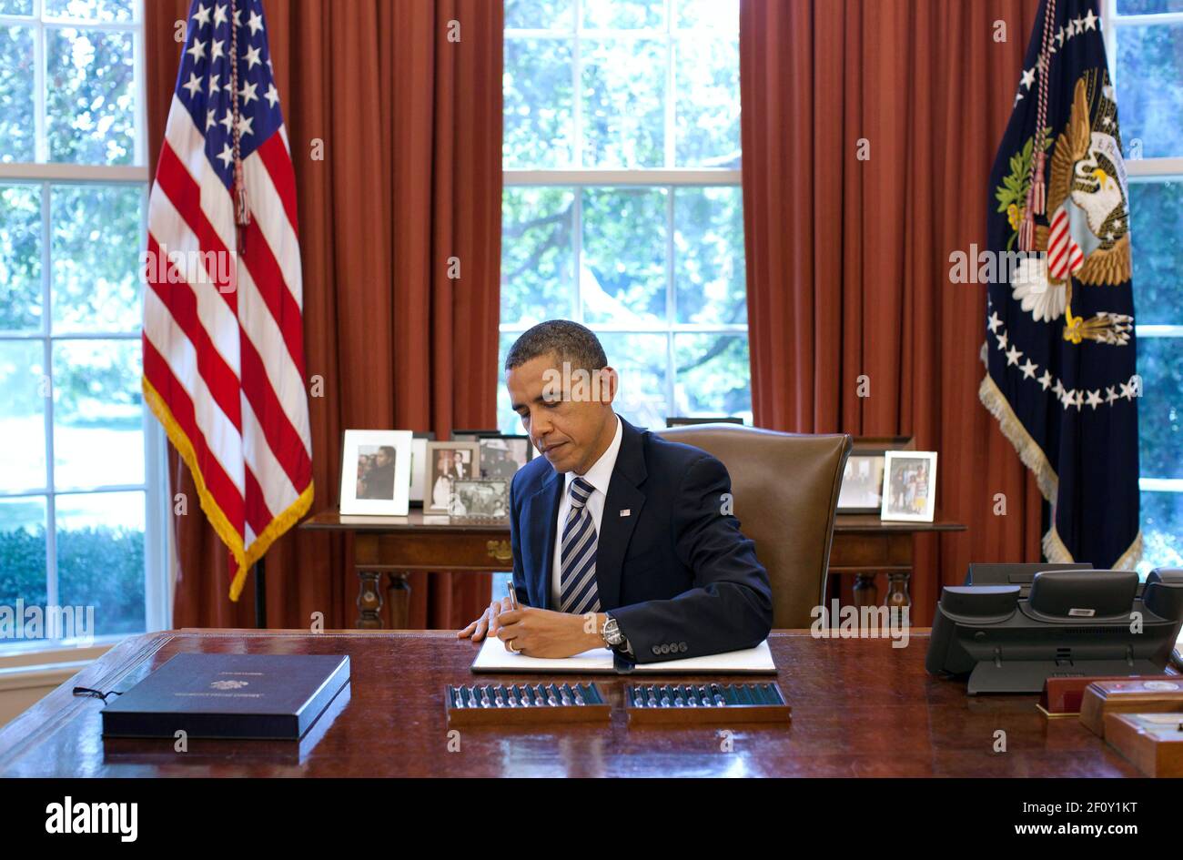 President Barack Obama signs the Budget Control Act of 2011 in the Oval ...