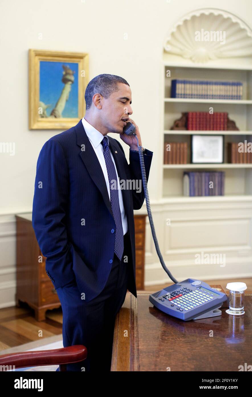 Barack Obama on a phone call in the Oval Office April 28, 2009 Stock ...