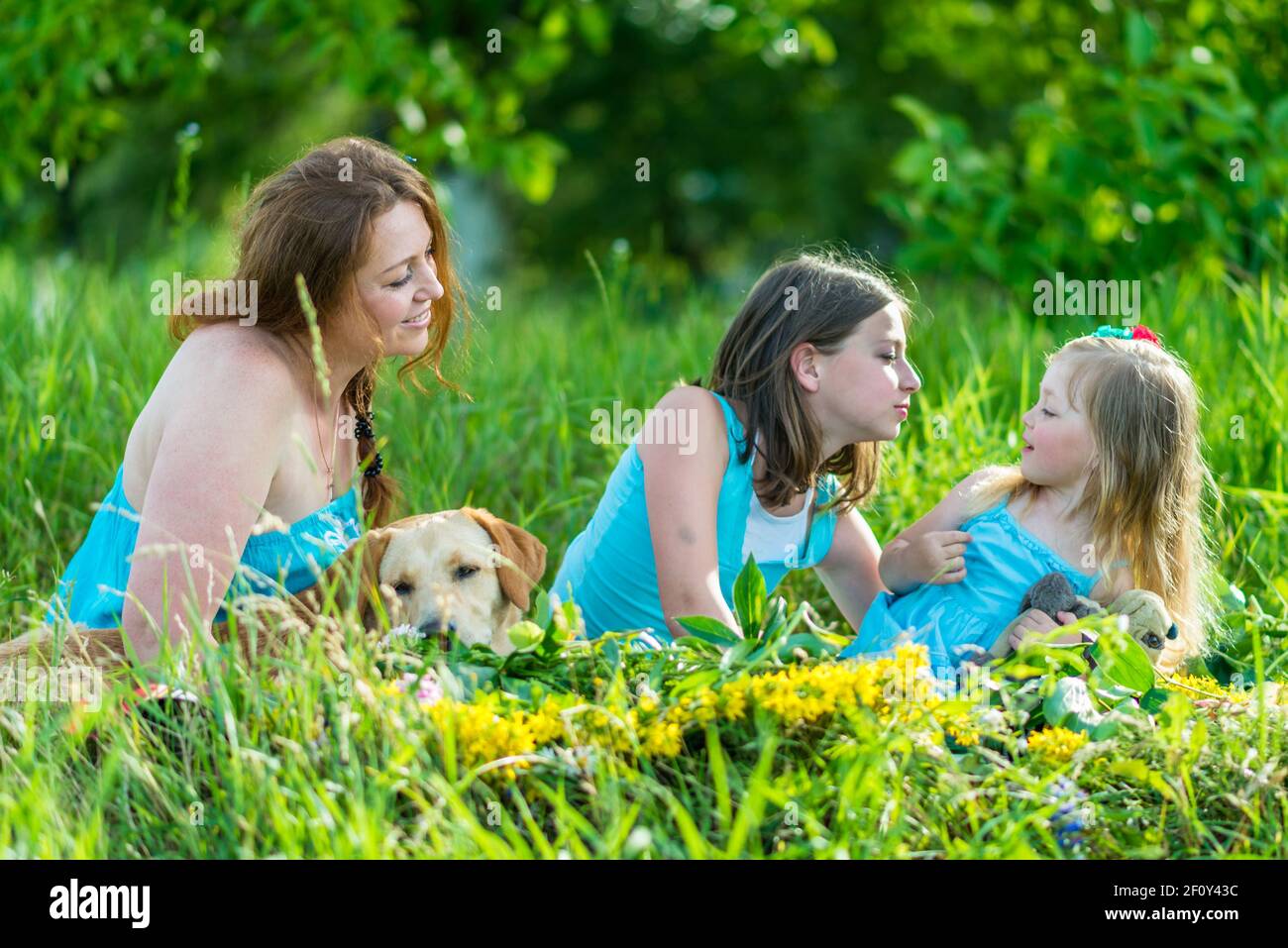 Mom and daughter with pet dog hi-res stock photography and images - Alamy