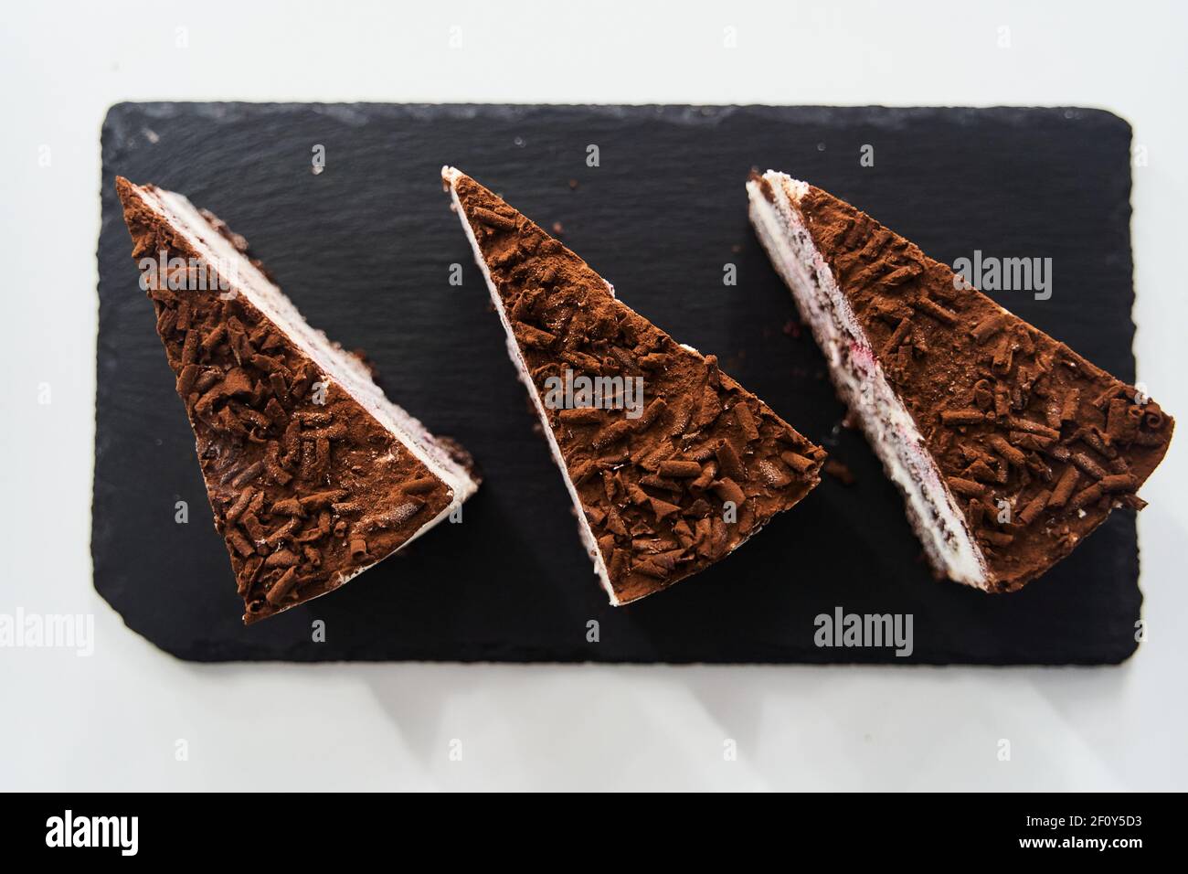 Triangular slice layered cake hi-res stock photography and images - Alamy