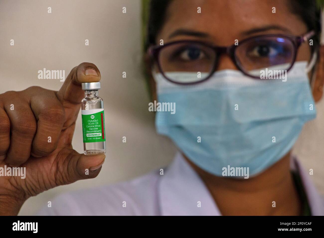 (3/6/2021) A healthcare worker holds a vial of COVISHIELD vaccine ...