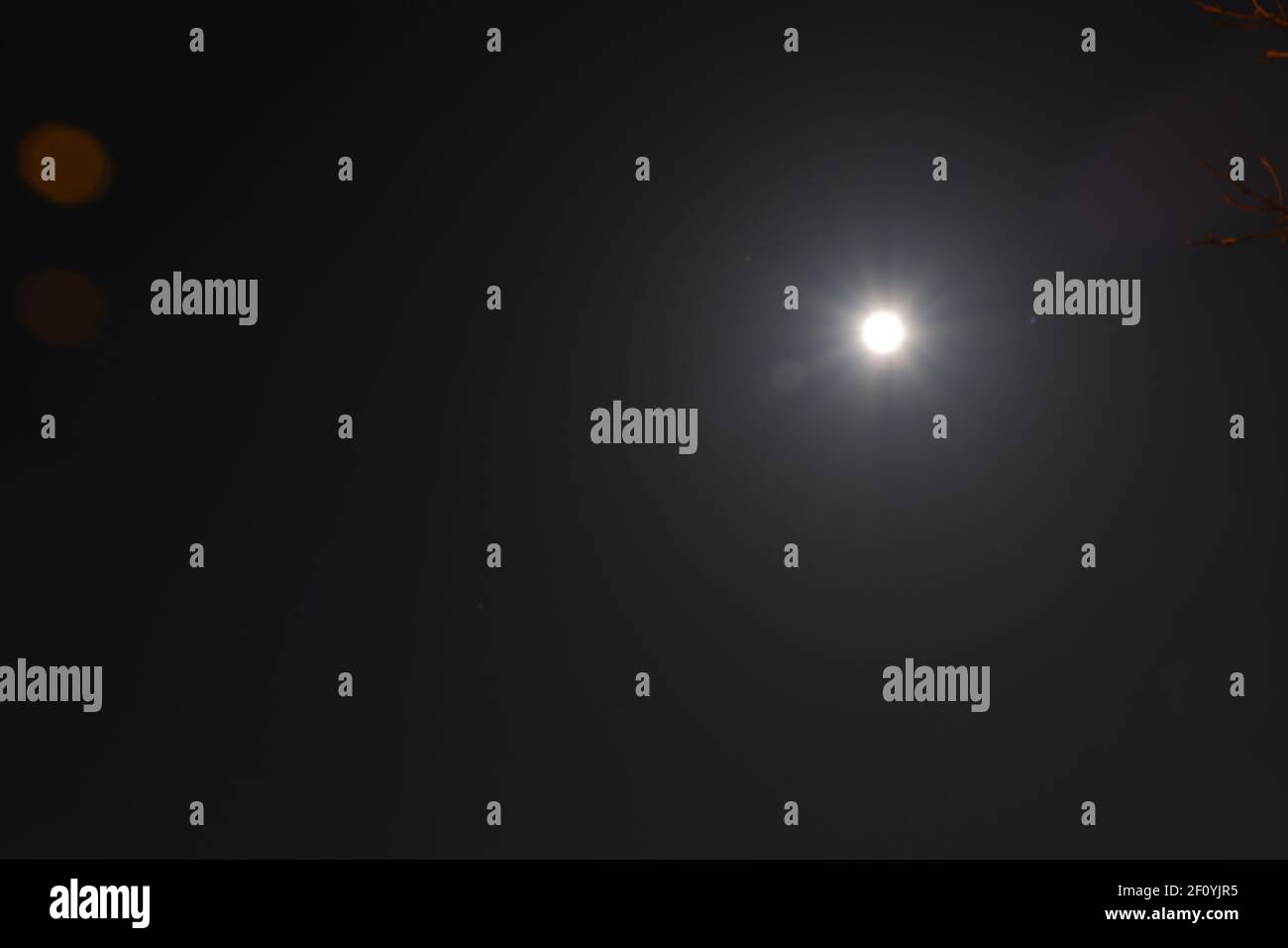 Full moon at midnight long exposure Stock Photo - Alamy