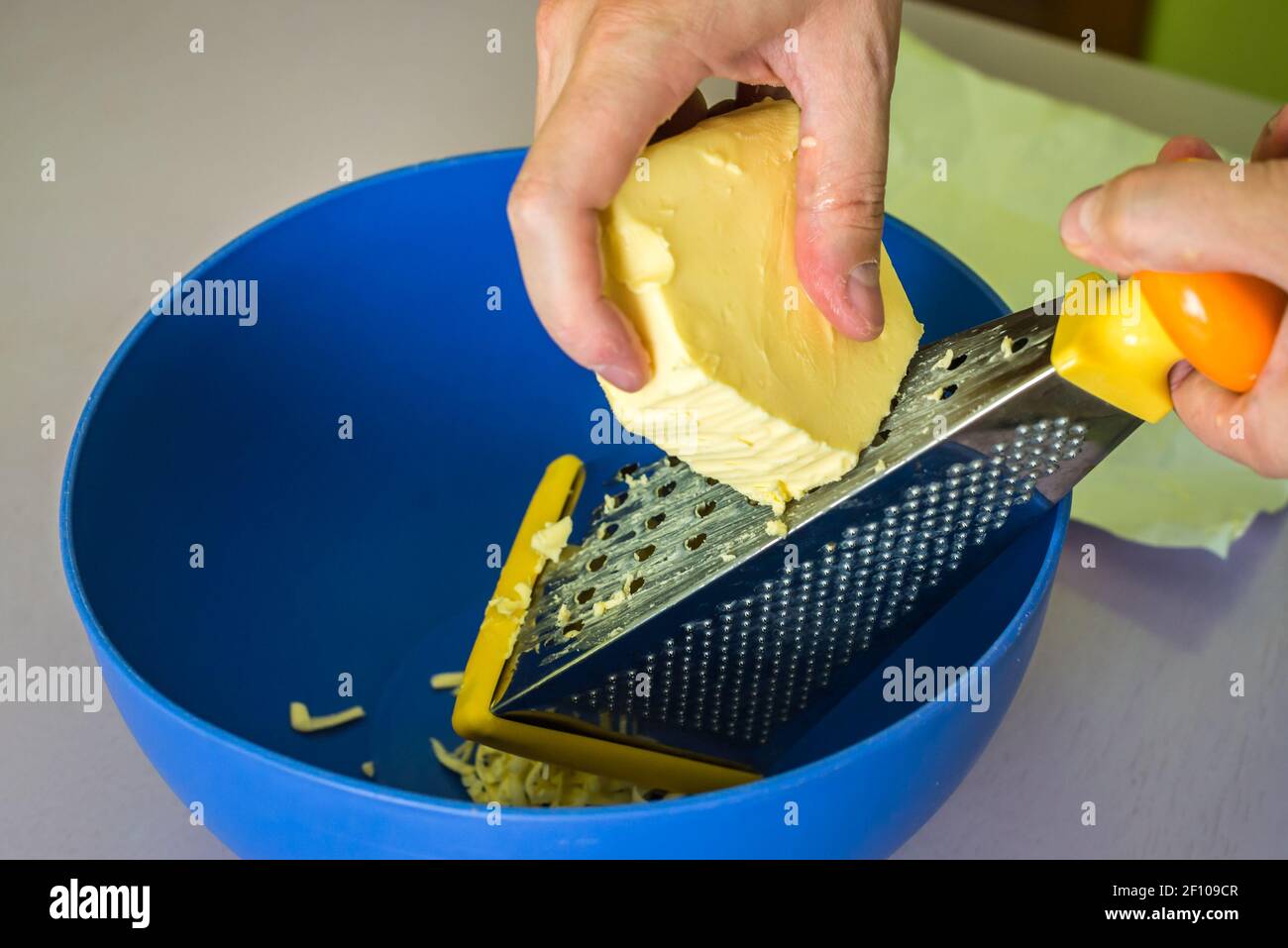 Hand shredded butter with grated Stock Photo - Alamy