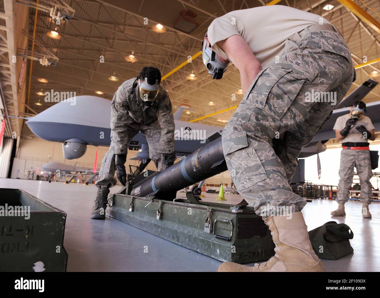 Senior Airmen Gale Passe (left) and Jason Atwell prepare to load an AGM ...