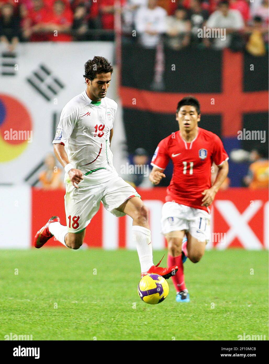 17 June 2009 - Seoul, South Korea : Iran player Shojaye Masoud (18) and South Korean Lee Keun-ho ...