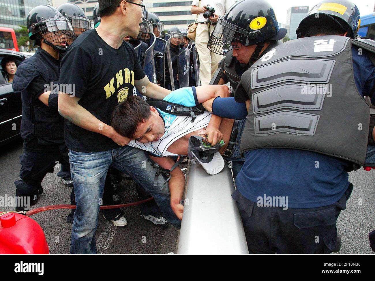 19 June 2009 - Seoul, South Korea - South Korean riot police arrest a ...