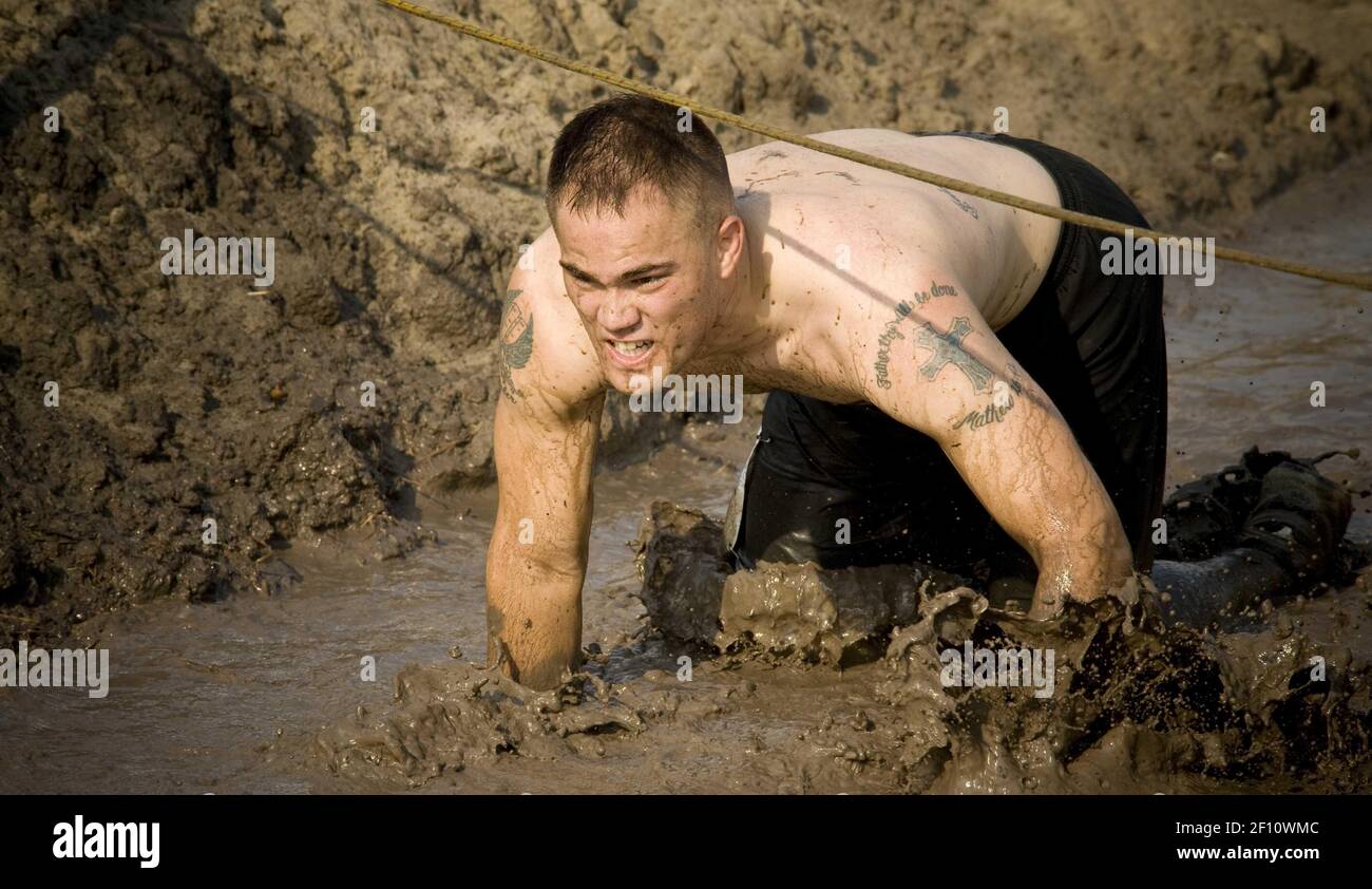 8 August 2009 - Norfolk, Virginia - Runners struggle through the mud ...