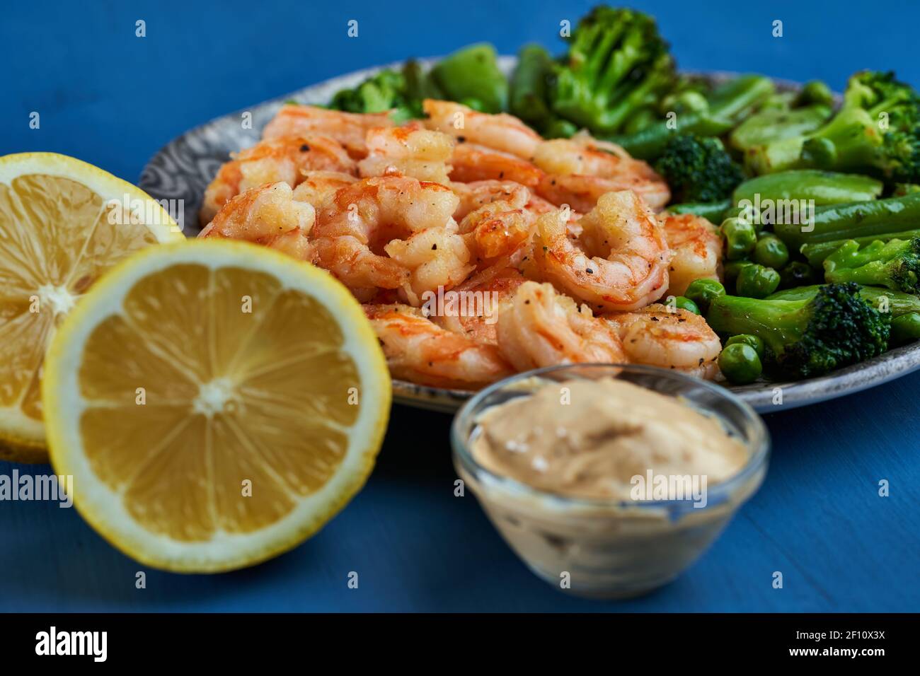 Delicious red king prawns prepared at wok on blue background Stock ...