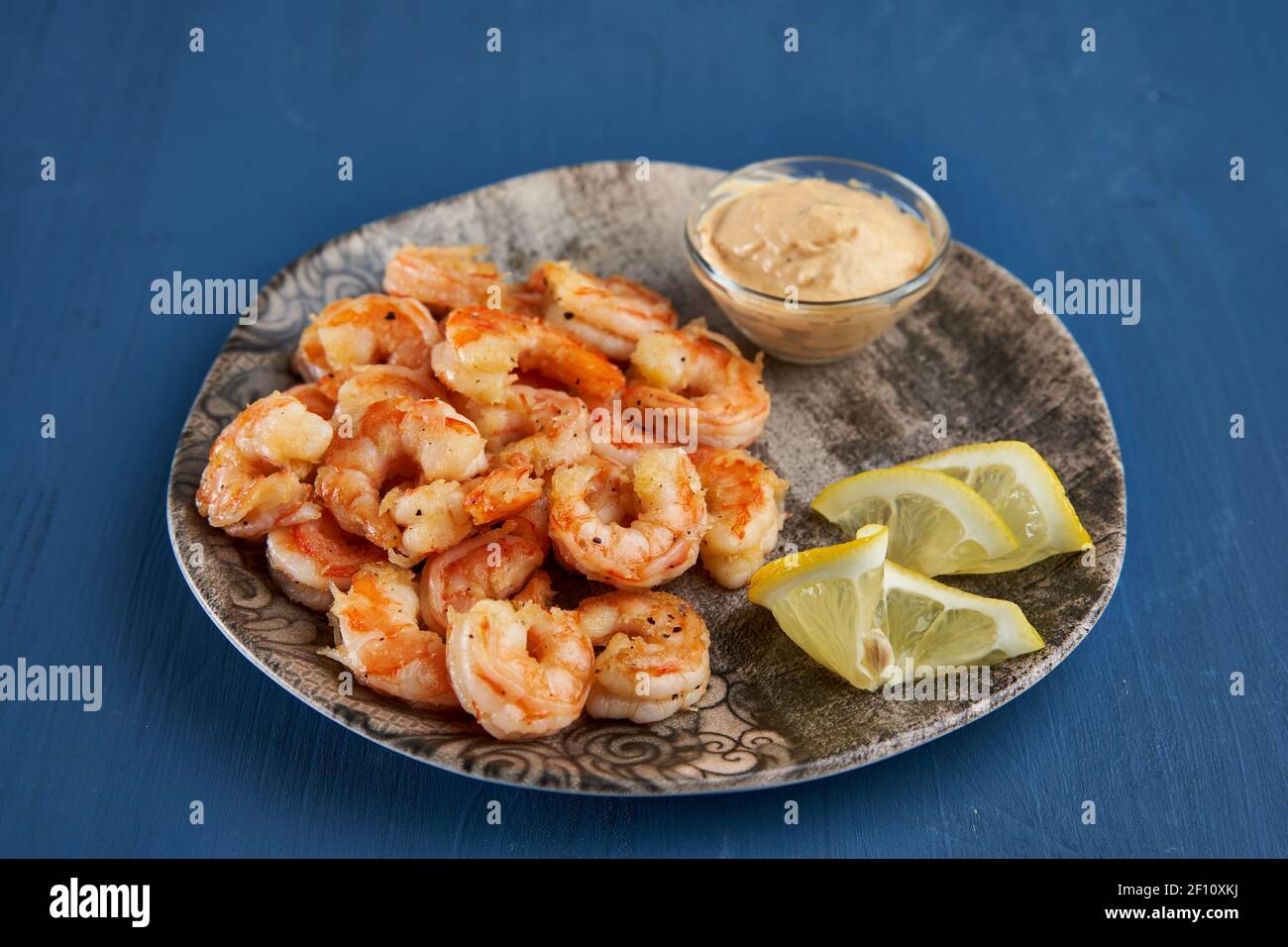 Delicious red king prawns prepared at wok on blue background Stock ...