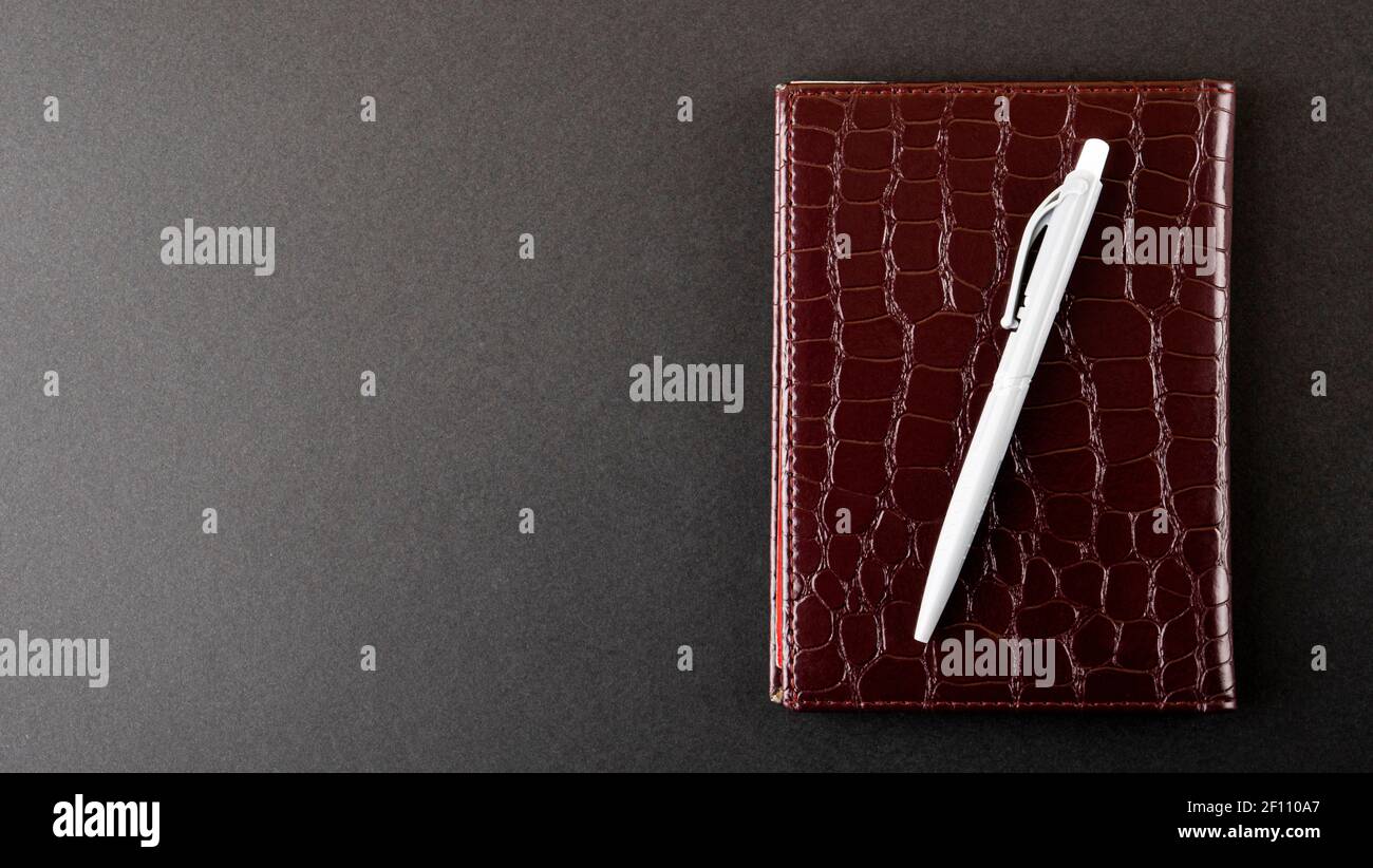 Notebook and ballpoint pen isolated on white background Stock Photo - Alamy