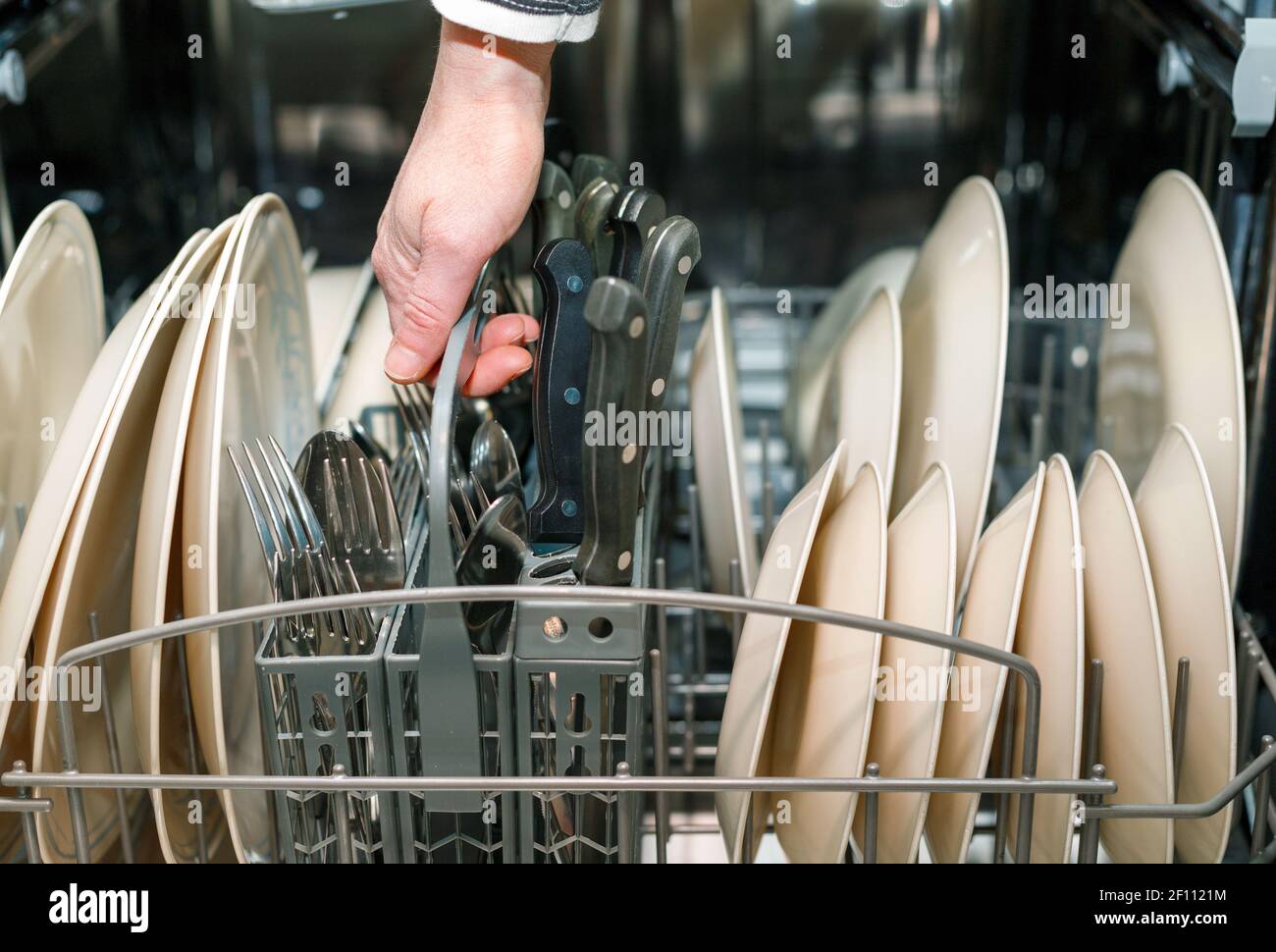 Woman loading dishwasher hi-res stock photography and images - Alamy