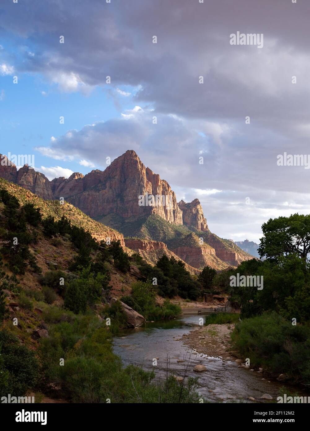 Pa'rus Trail view of Watchman mountain and Virgin River. Sunset lits up ...