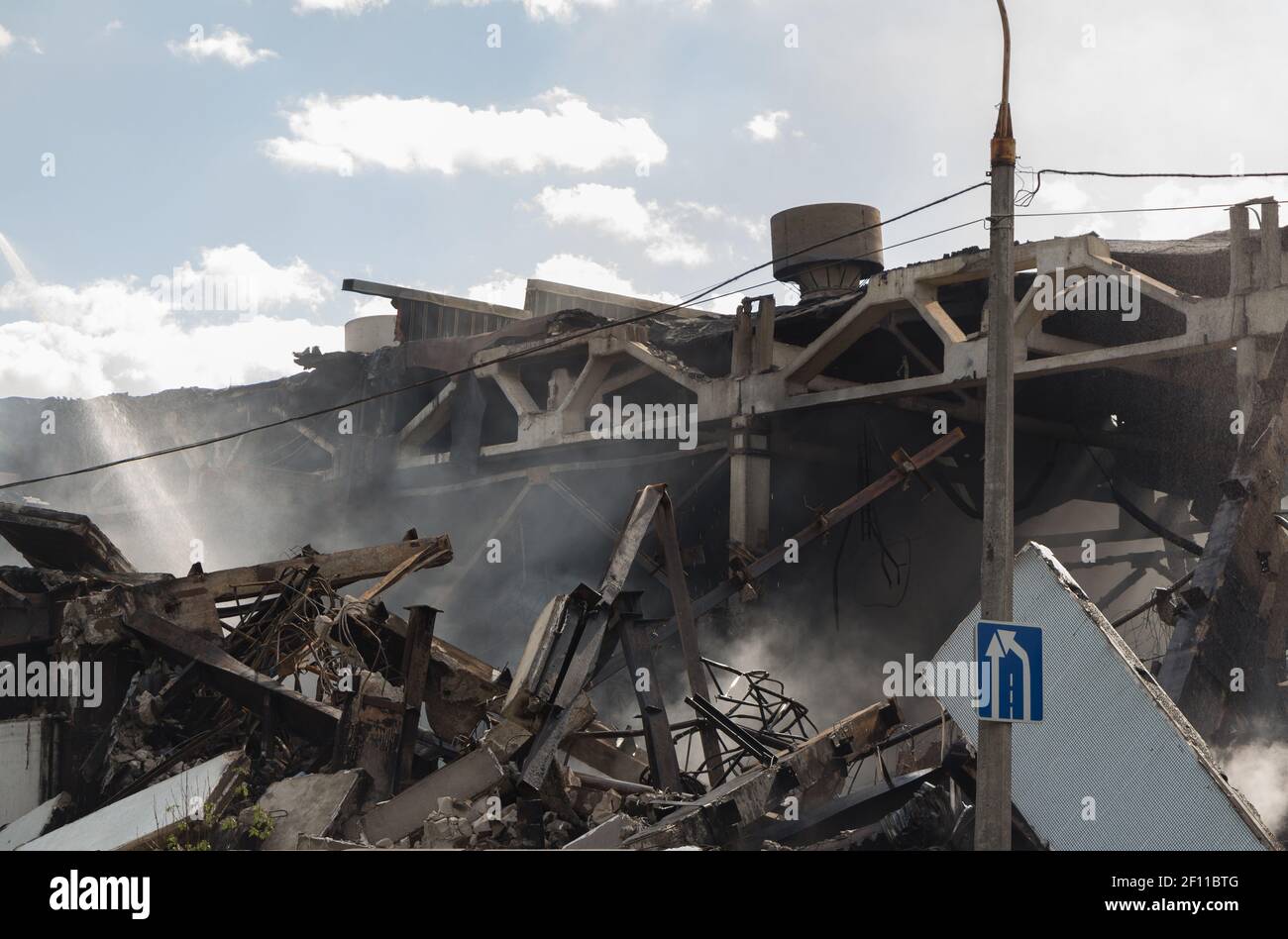 Technological disaster, fire, destroyed industrial building, smoke and ...