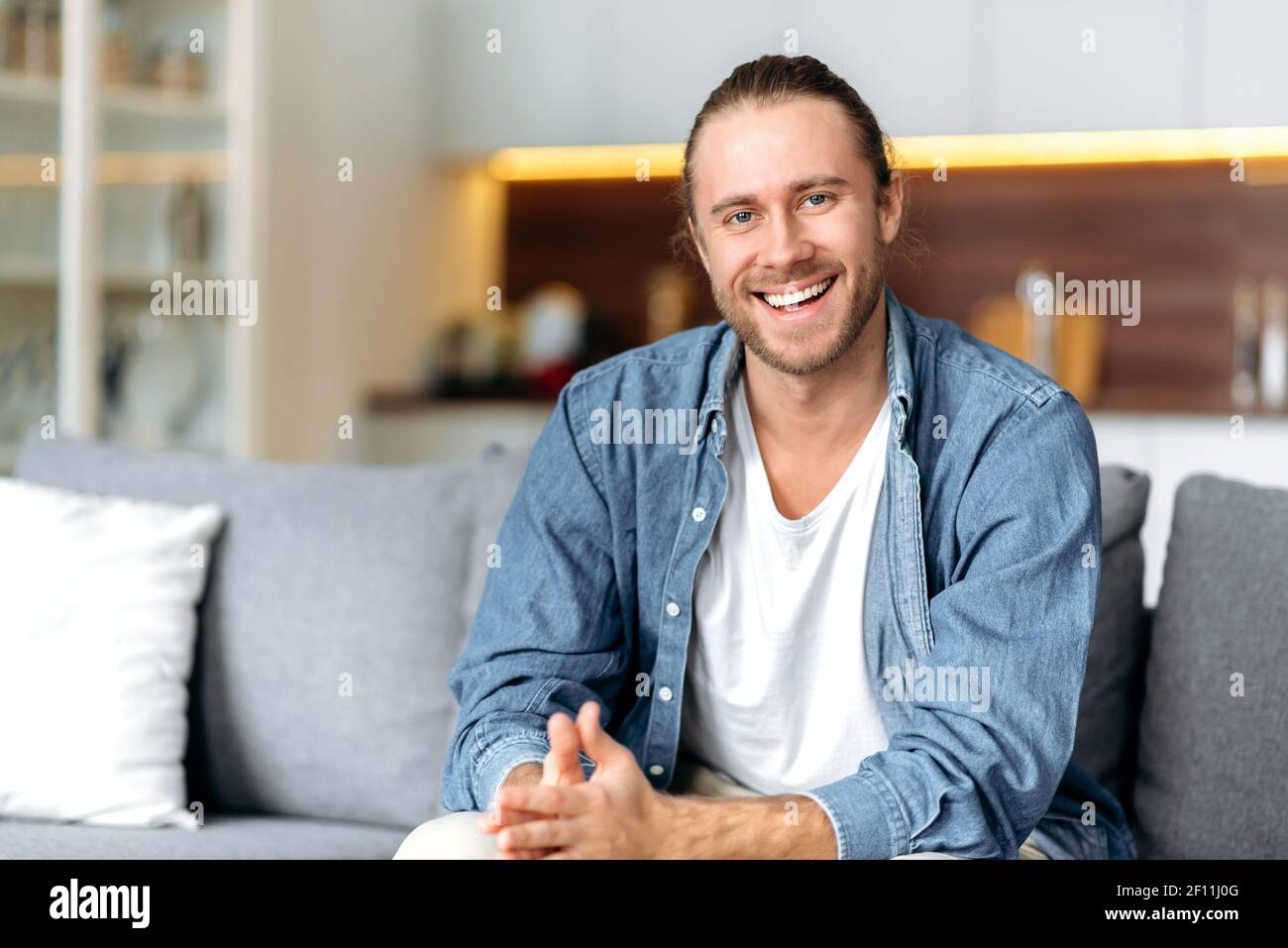Portrait of an attractive charismatic caucasian blue-eyed guy in a ...