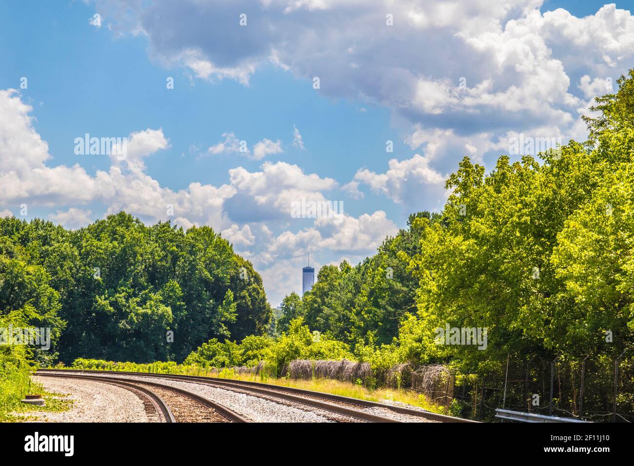 Atlanta, Ga / USA - 07 15 20: Westin skyscraper in view between trees ...