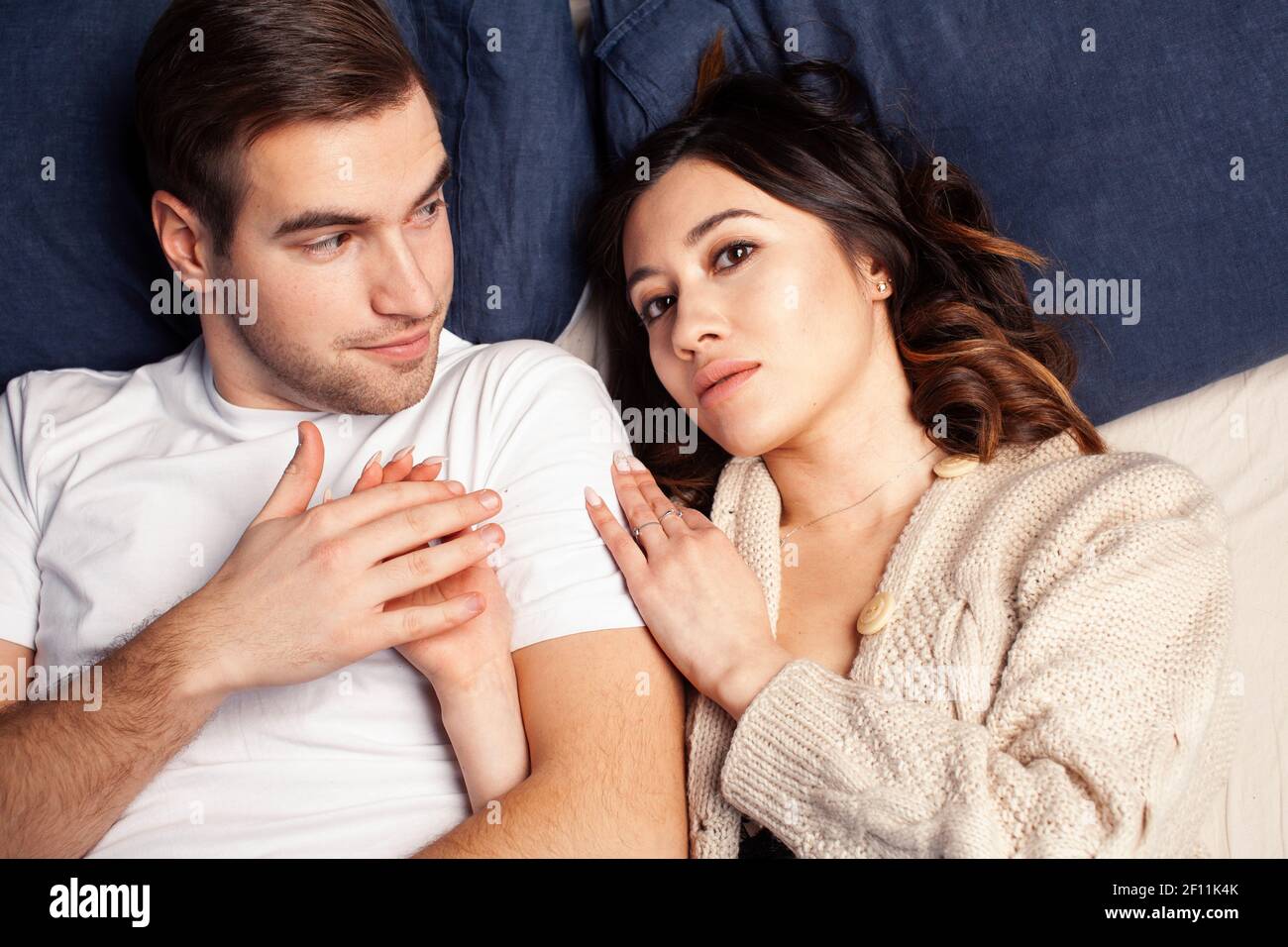 young pretty couple together in bed sleeping chill, lifestyle people ...