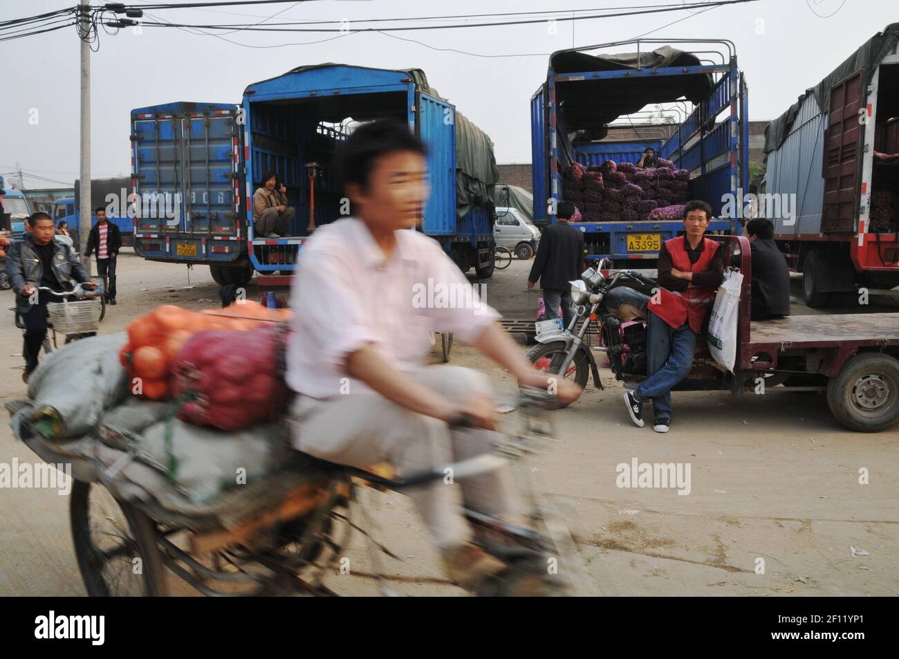 A three wheeled carrier on its way to delivering. (Photo by Raphael ...