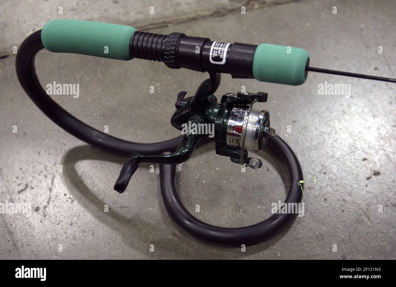 The free standing base of the Cobra Ice Rods incorporates the reel and ...