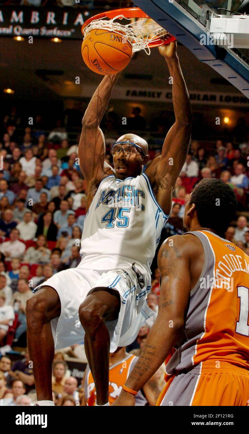 Orlando Magic forward Bo Outlaw slams over Phoenix Suns center Amare ...