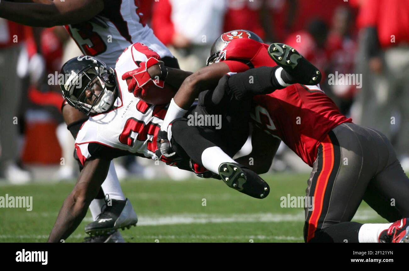 Atlanta Falcons ball carrier Jerious Norwood (32) gets slammed hard by ...