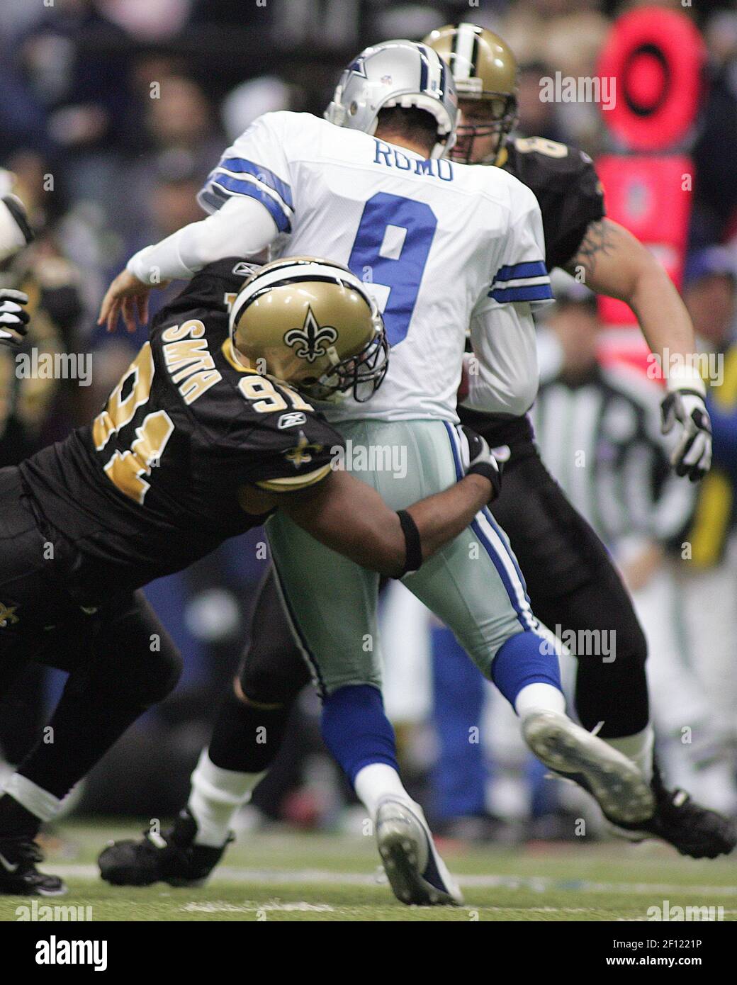 Will Smith of the New Orleans Saints hits Dallas Cowboys quarterback ...