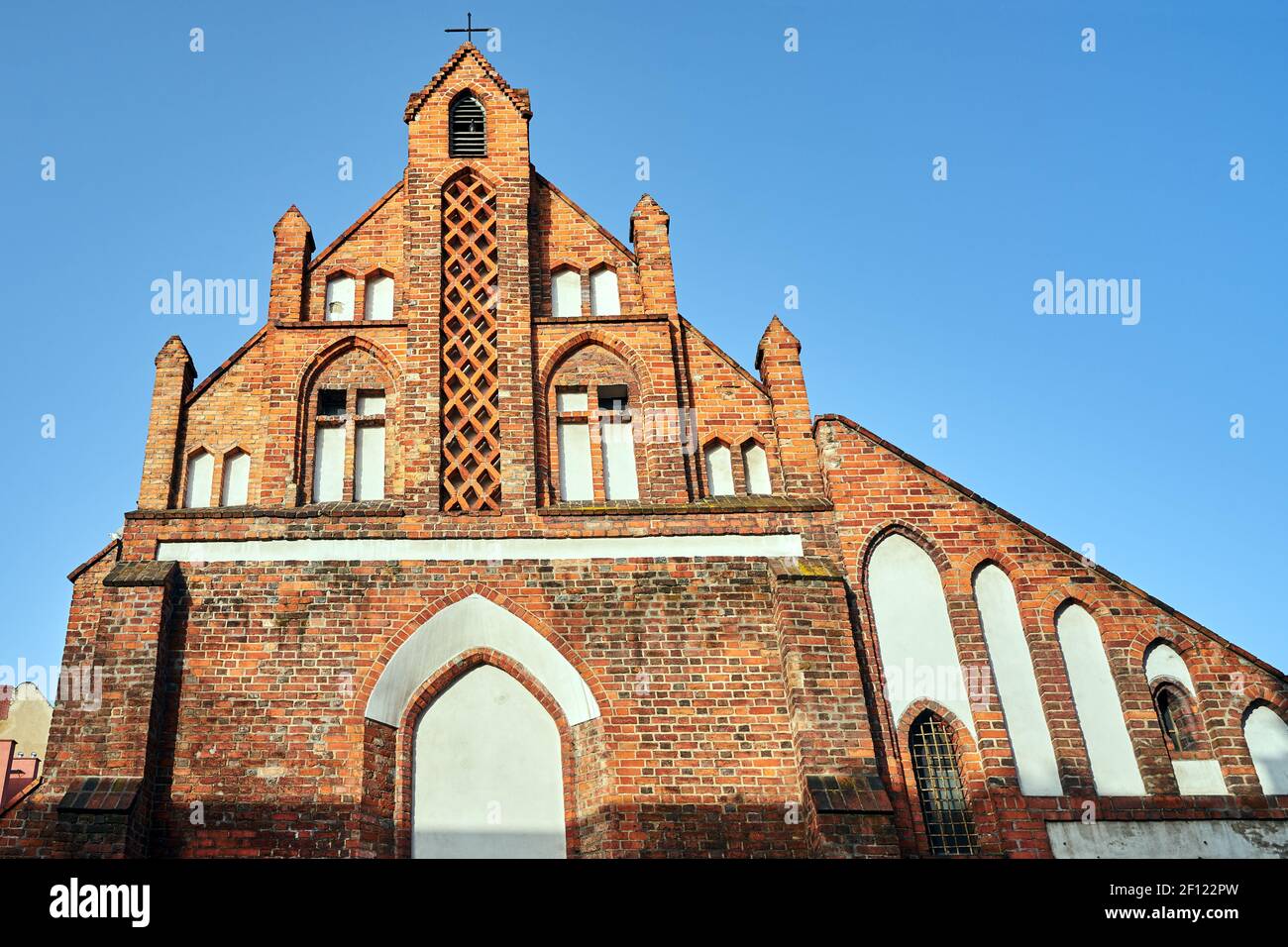 a facade of medieval Catholic church in Poznan Stock Photo - Alamy
