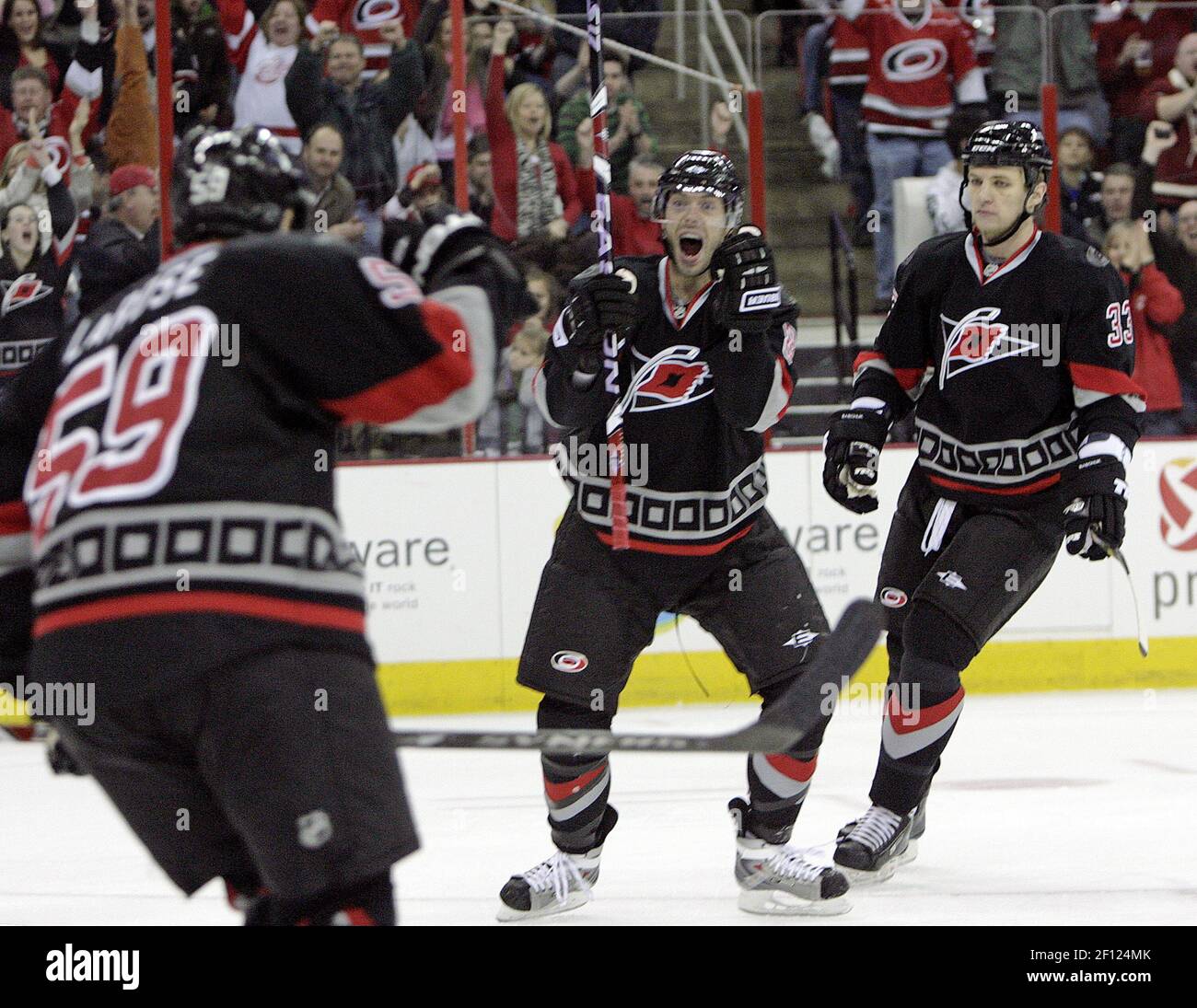 Carolina Hurricanes' Matt Cullen (8) celebrates his goal with teammates ...