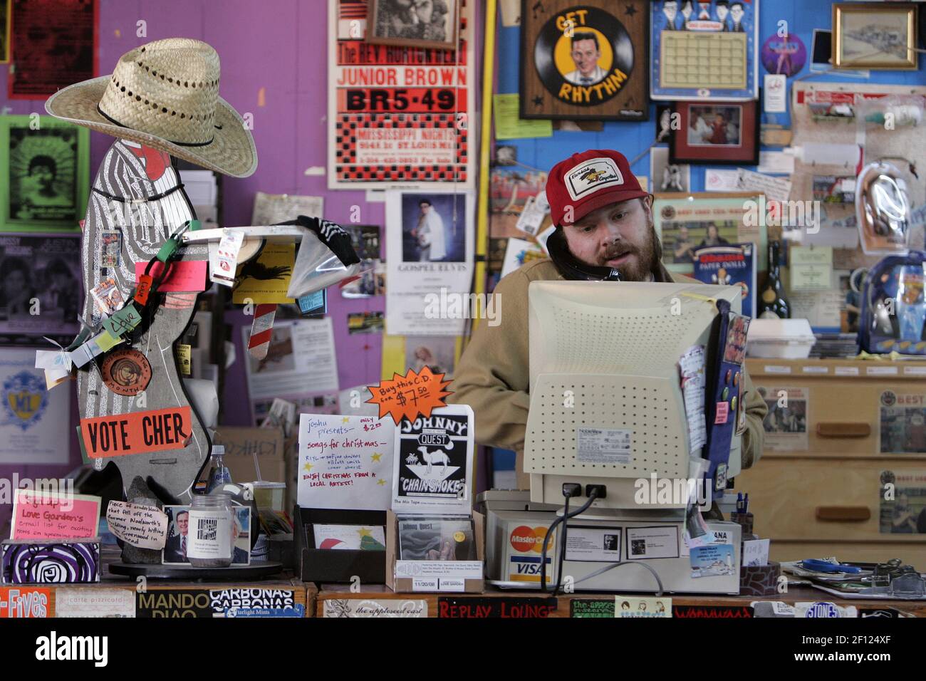 Kelly Corcoran, owner of Love Garden Sounds, takes care of a phone ...