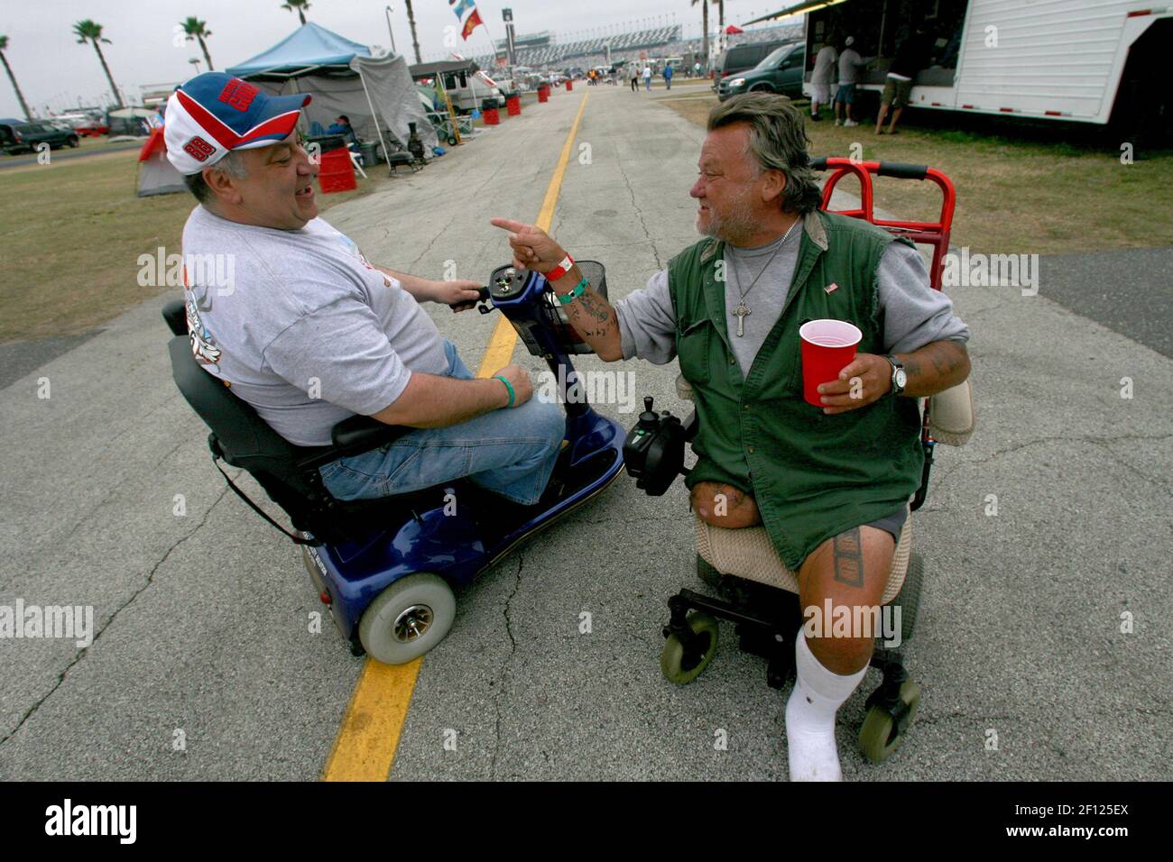Mike Howell, left, and Buddy Maresca talk about their scooter race in ...