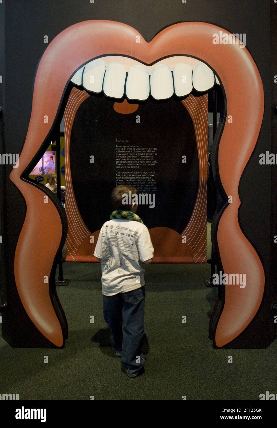 Logan Weidner 8, enters a mockup of a huge mouth inside the Microbes ...
