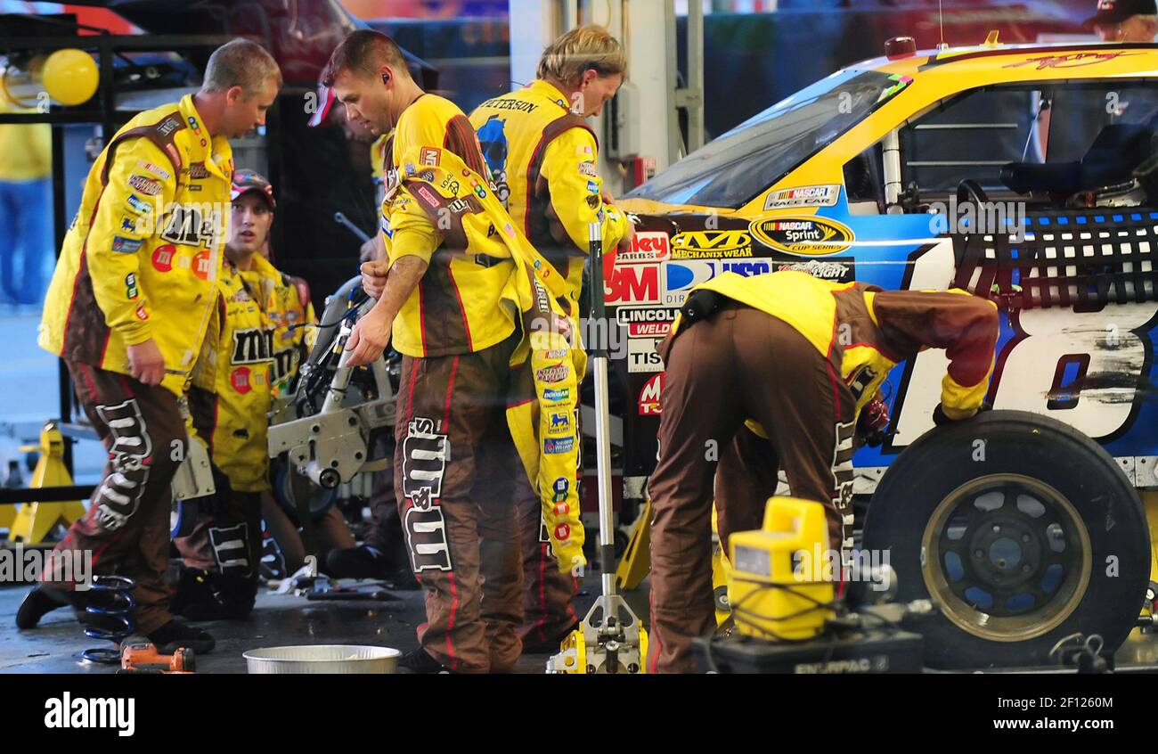 NASCAR driver Kyle Busch's team works on his car following an accident ...